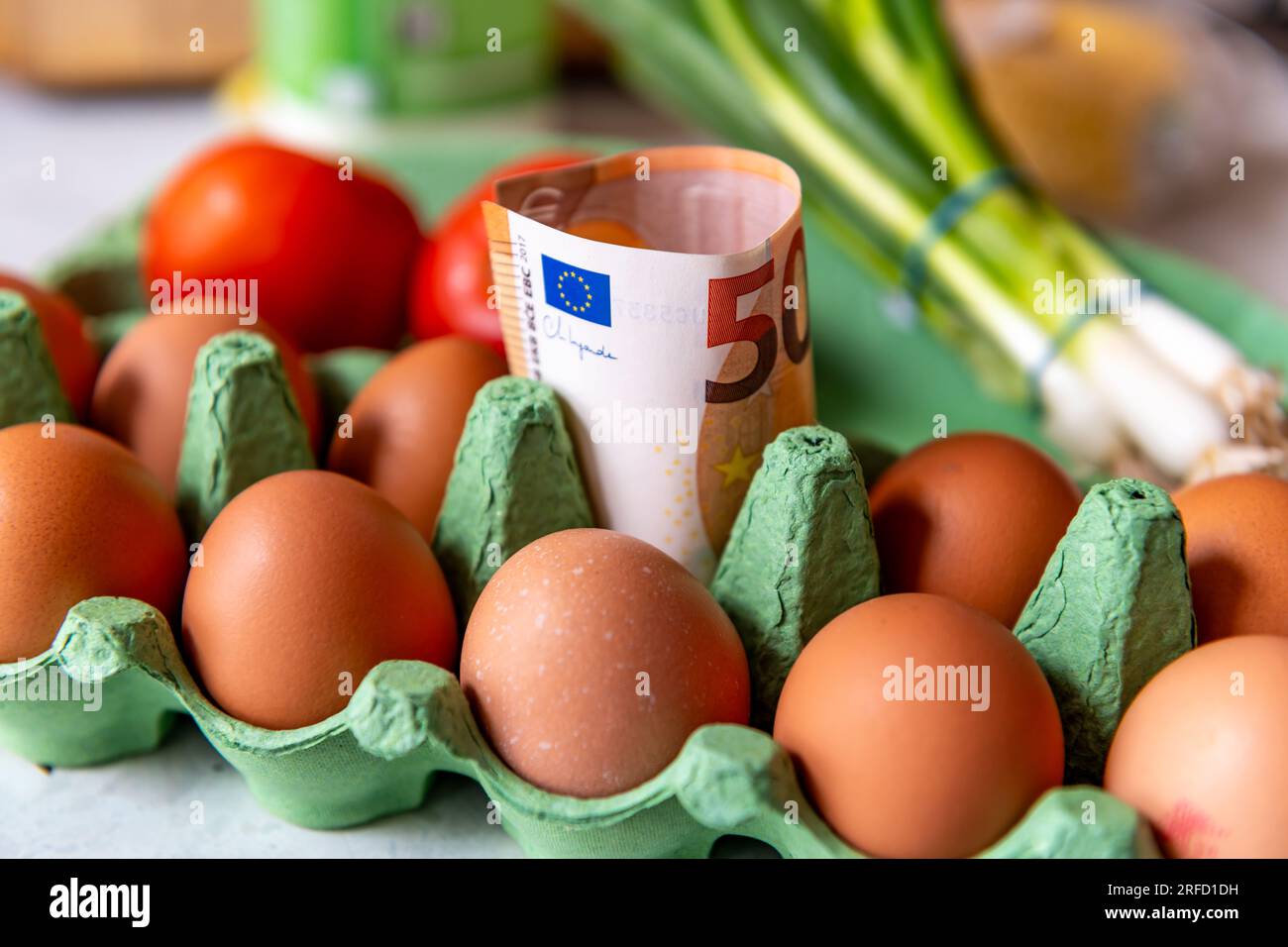 A cost of living, food inflation concept with Euro bank notes in a ...