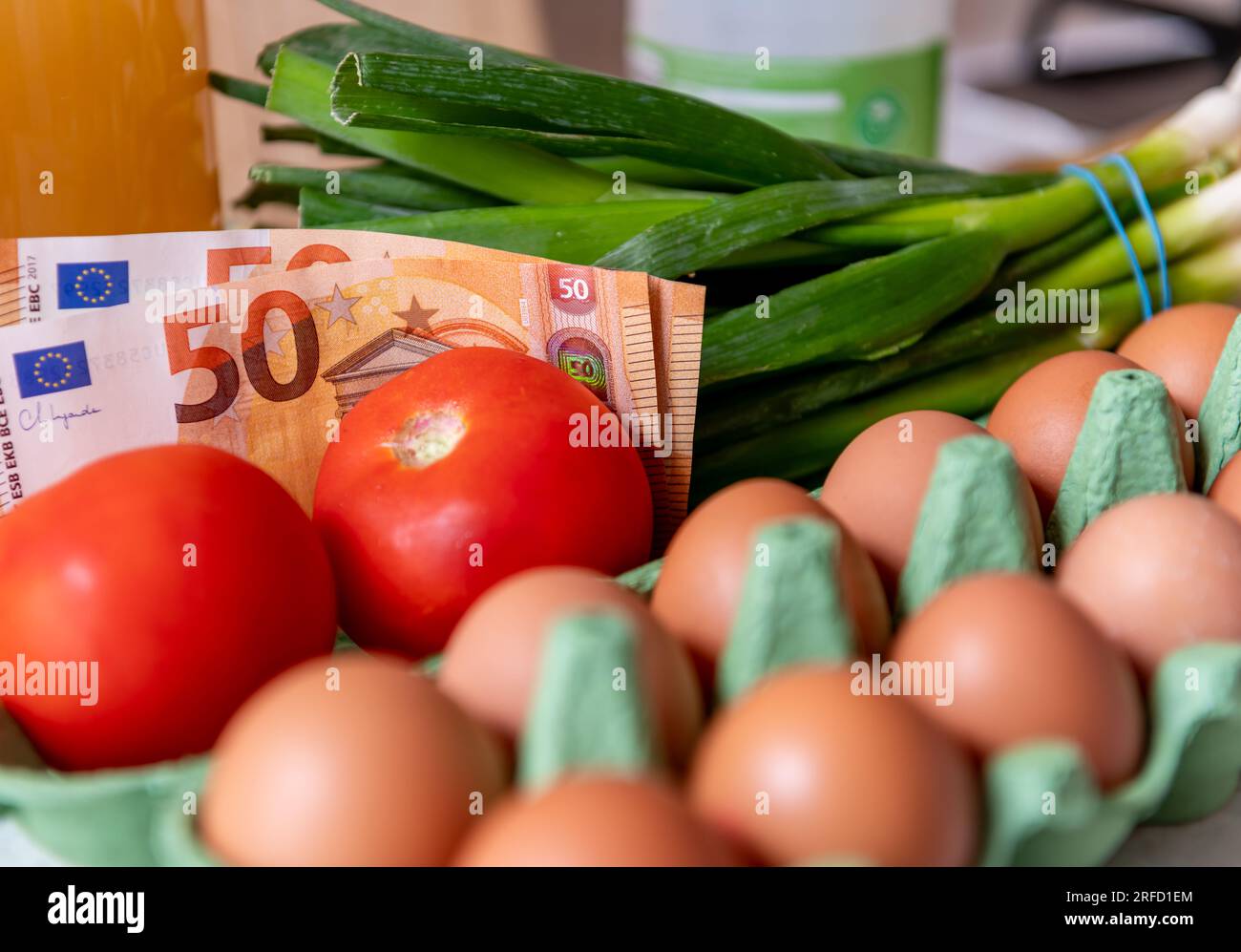 A cost of living, food inflation concept with Euro bank notes and ...