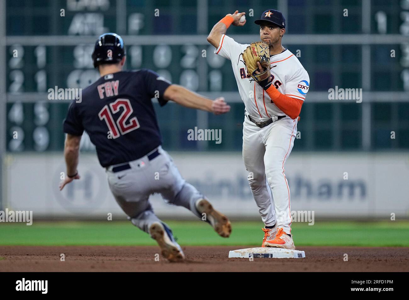 Houston Astros shortstop Jeremy Pena turns a double play on Cleveland ...