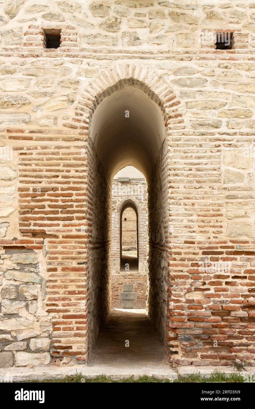 photo of narrow passageway between castle walls Stock Photo - Alamy