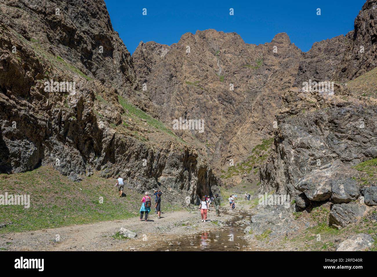 People hiking in the Yolyn Am (Gurvan Saikhan National Park), a deep ...