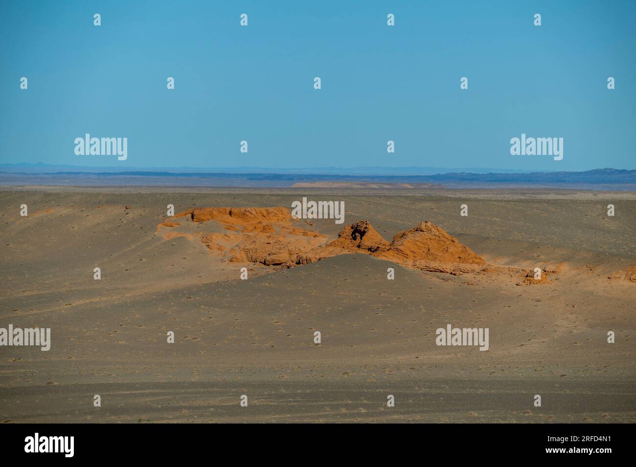 Landscape with sedimentary red rock at the Hongoryn Els sand dunes in ...