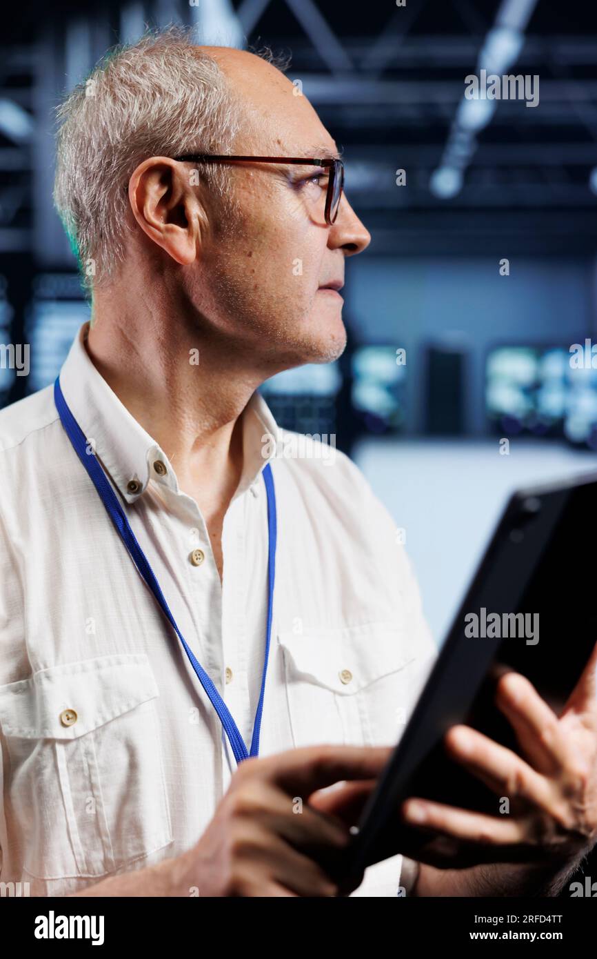 Mechanic in crypto mining farm with specialized systems using ...