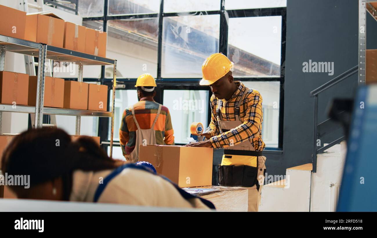 African american men packing products hi-res stock photography and ...