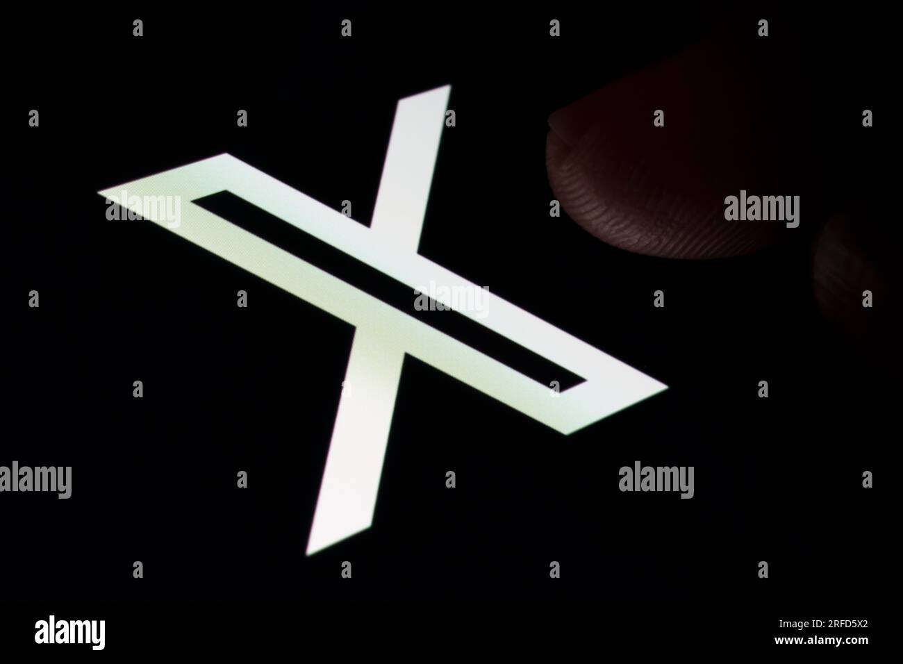 Twitter X app logo seen on screen of smartphone. Twitter rebrands as X ...