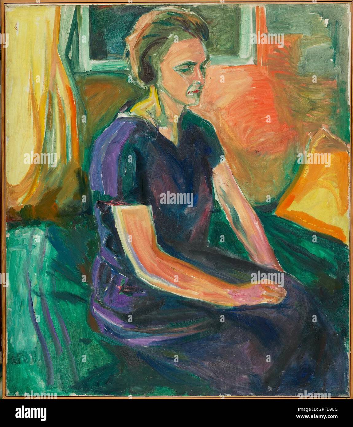 Seated woman in blue dress hi-res stock photography and images - Alamy