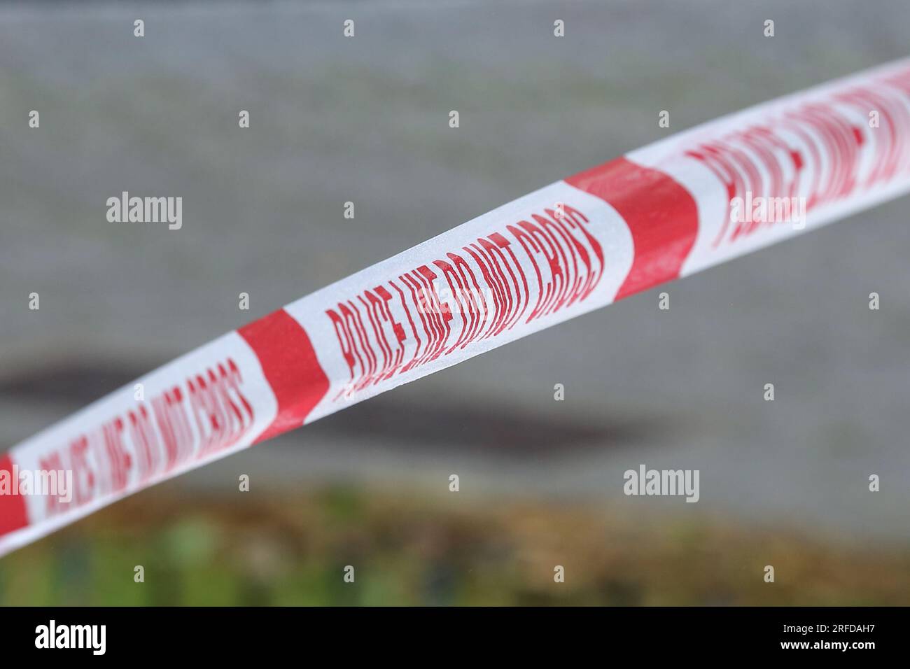 Police tape seen at the crime scene in London Stock Photo - Alamy