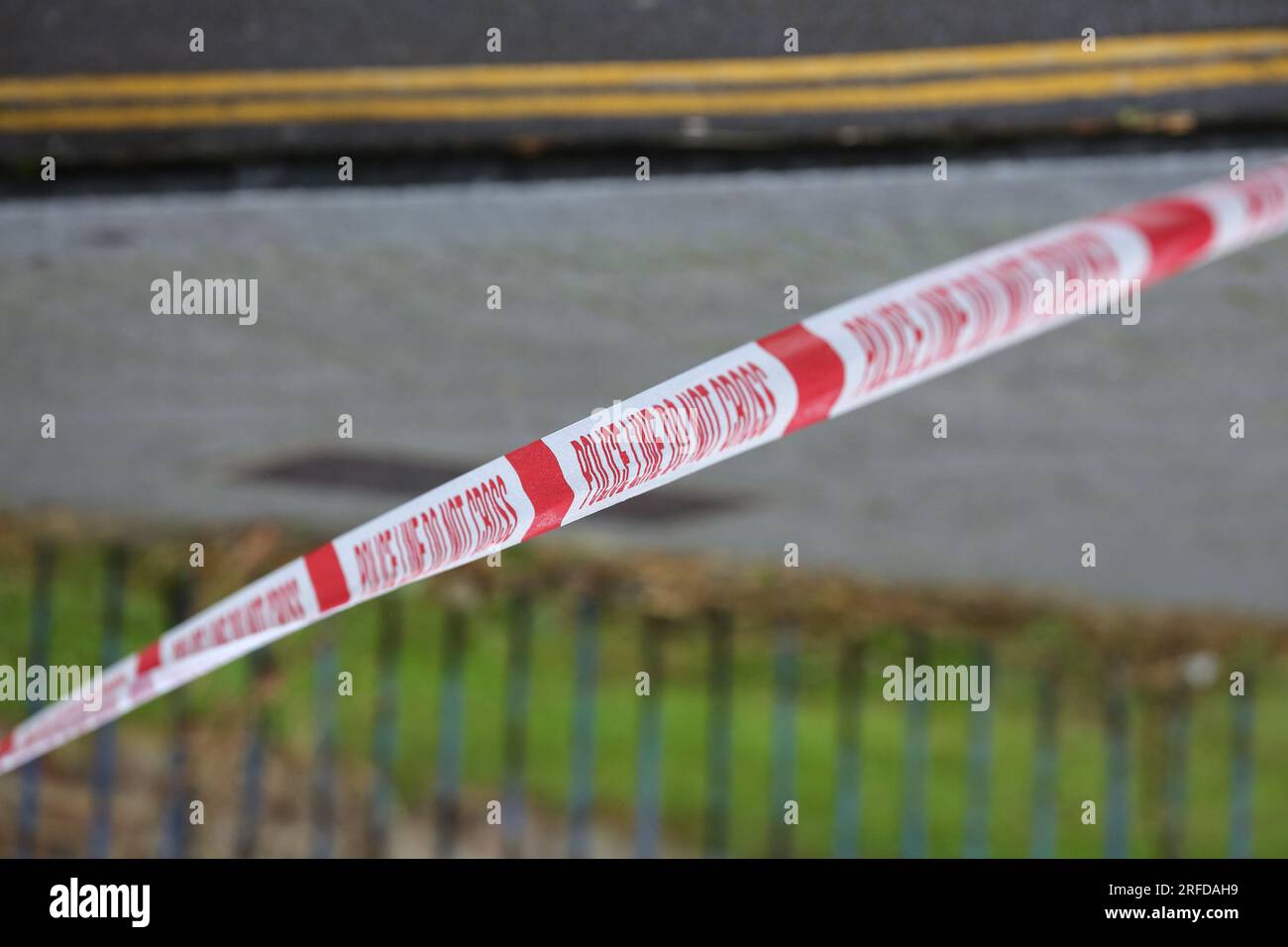 Police tape seen at the crime scene in London Stock Photo - Alamy