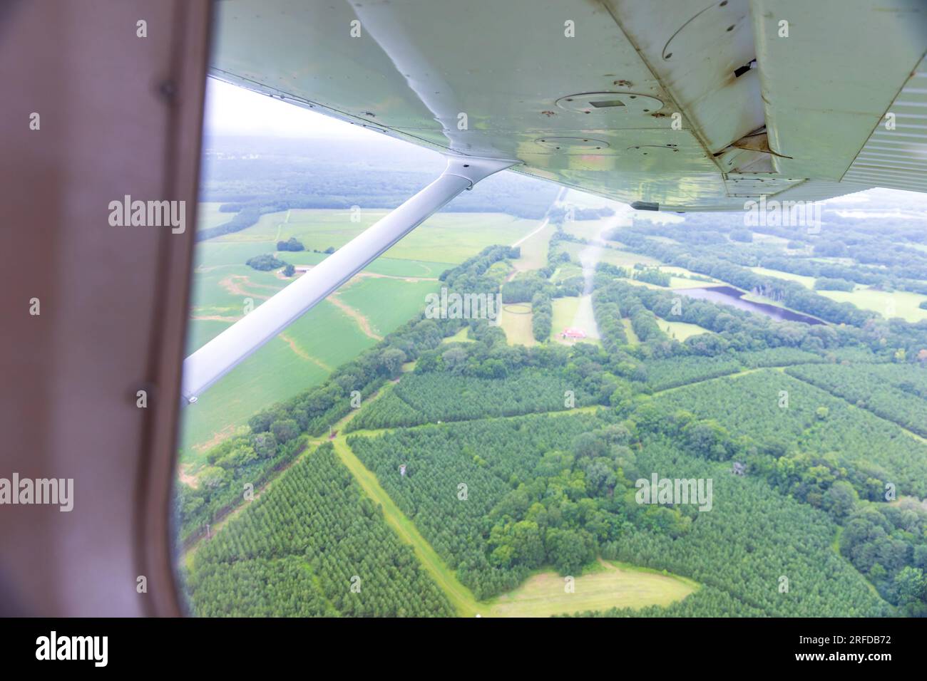 View out of the window of small airplane in flight Stock Photo - Alamy