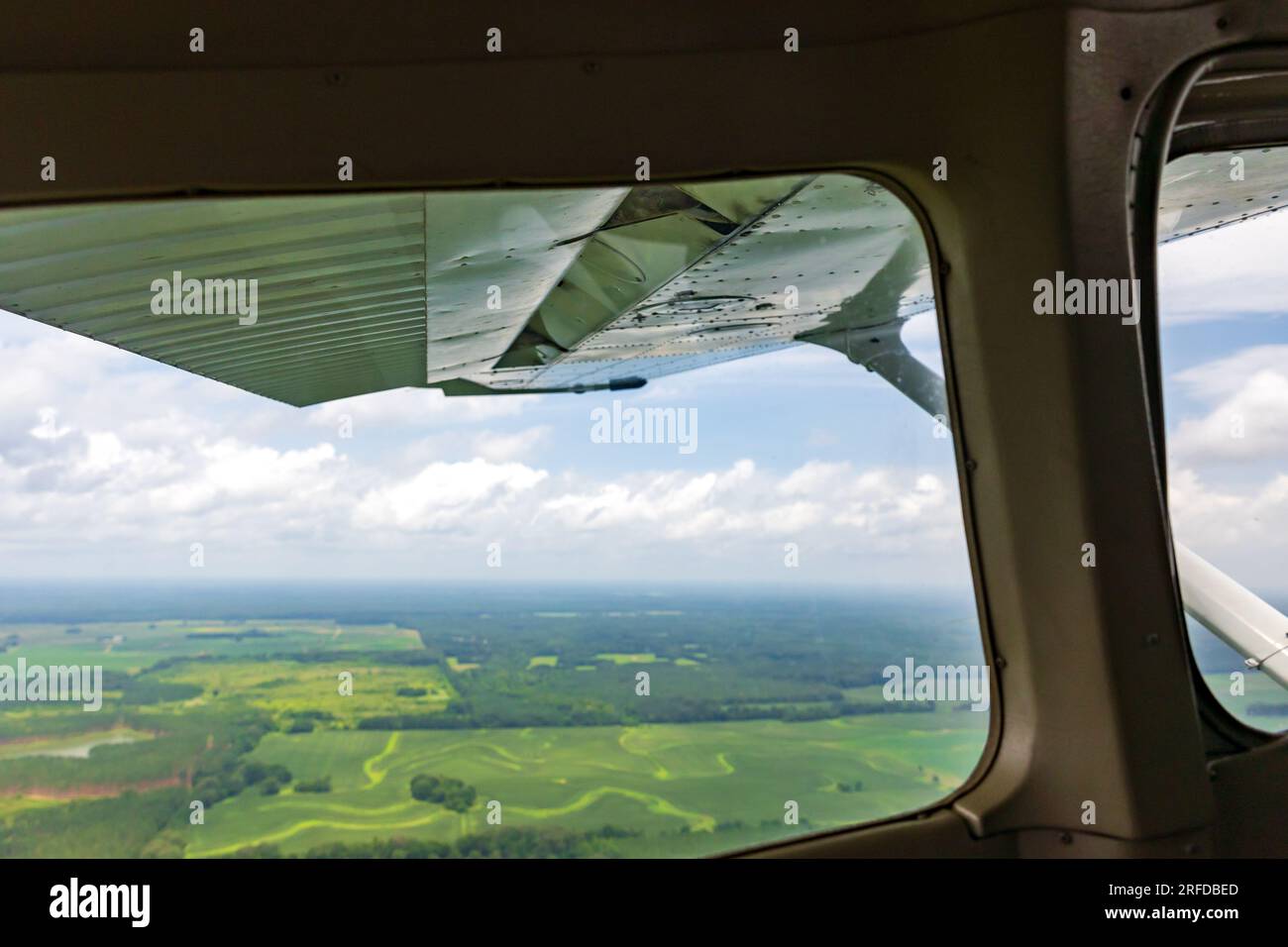 View out of the window of small airplane in flight Stock Photo - Alamy