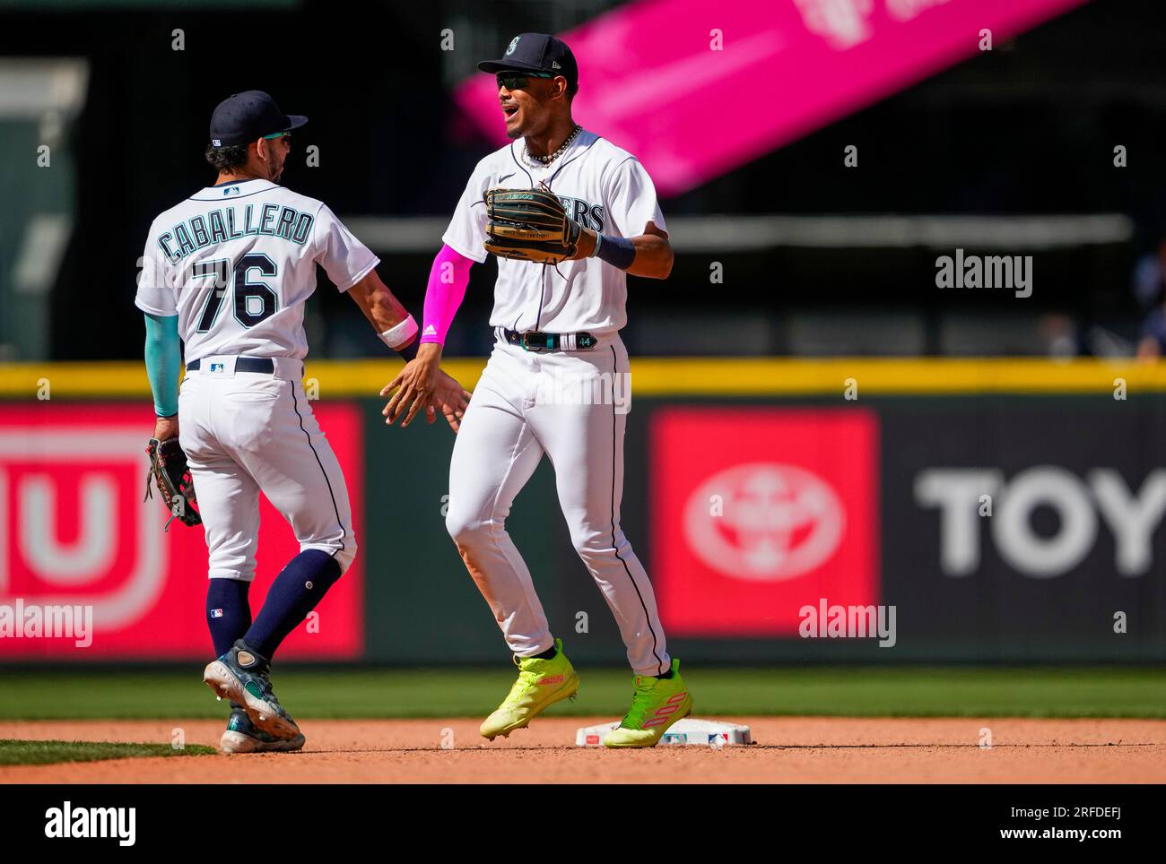 Seattle Mariners second baseman Jose Caballero (76) greets center ...