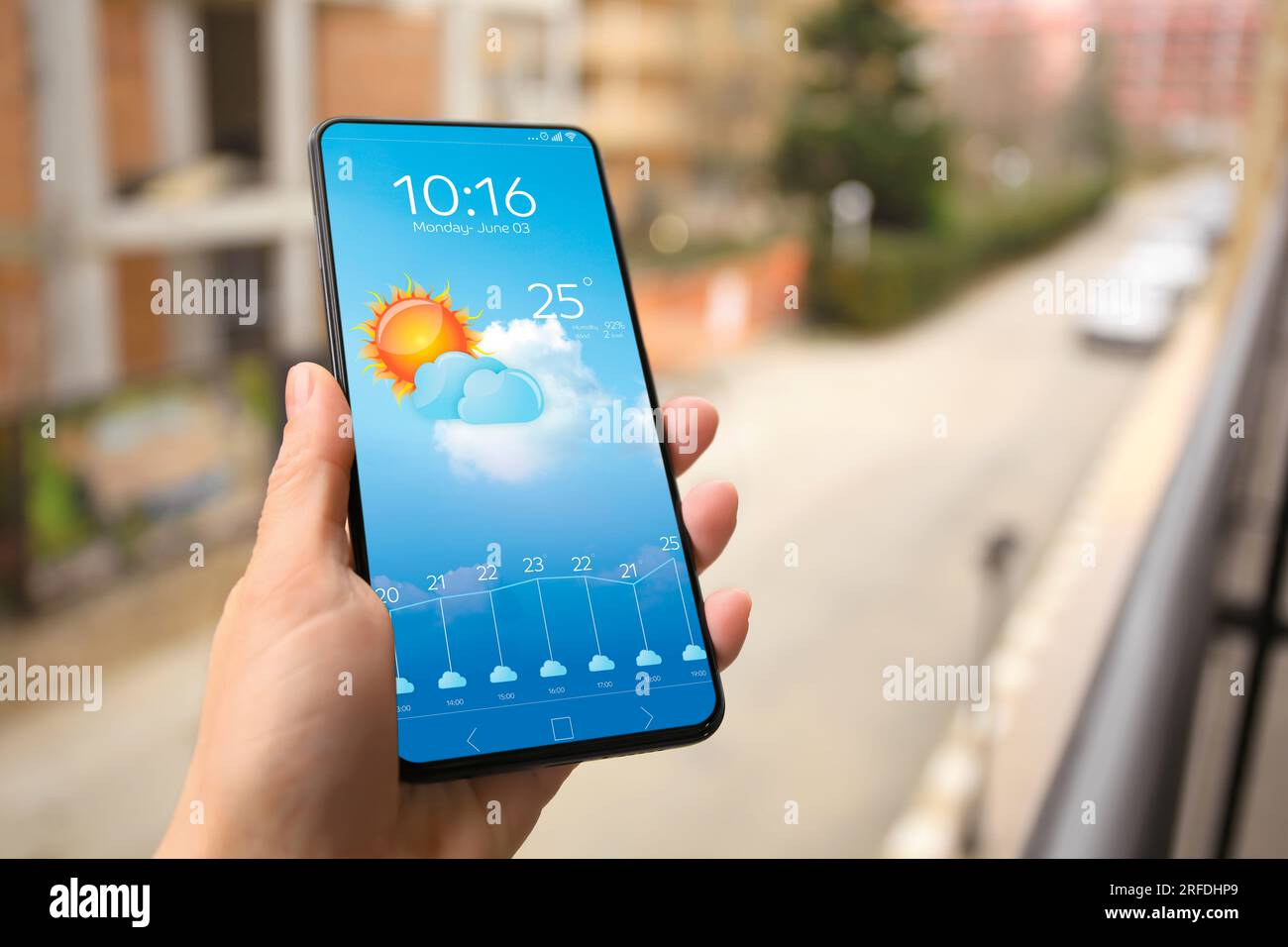Woman checking weather using app on smartphone outdoors, closeup. Data ...