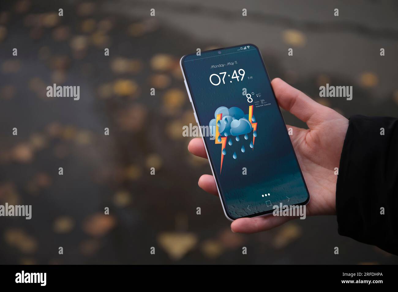 Woman checking weather using app on smartphone on street, closeup. Data ...