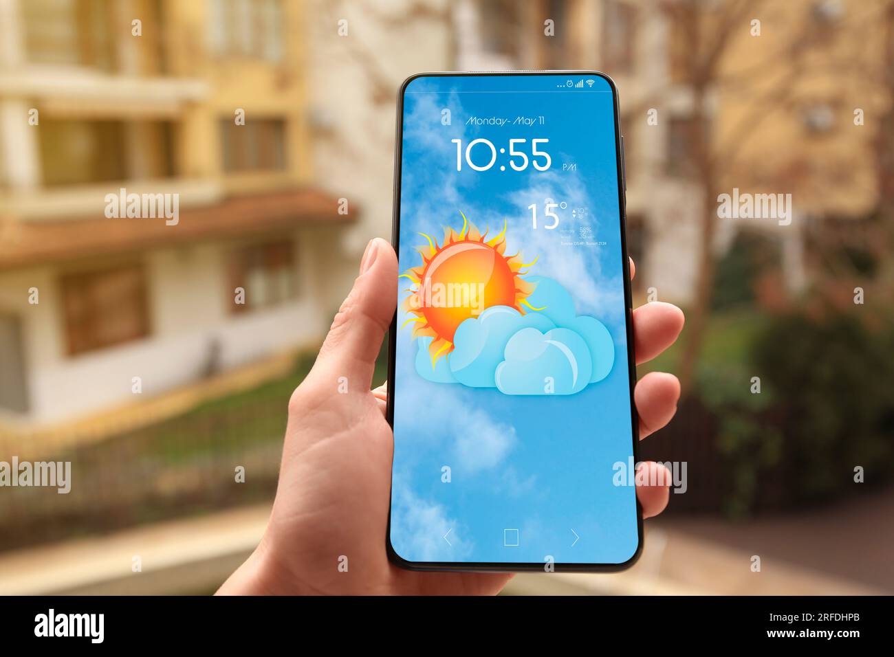 Woman checking weather using app on smartphone outdoors, closeup. Data ...