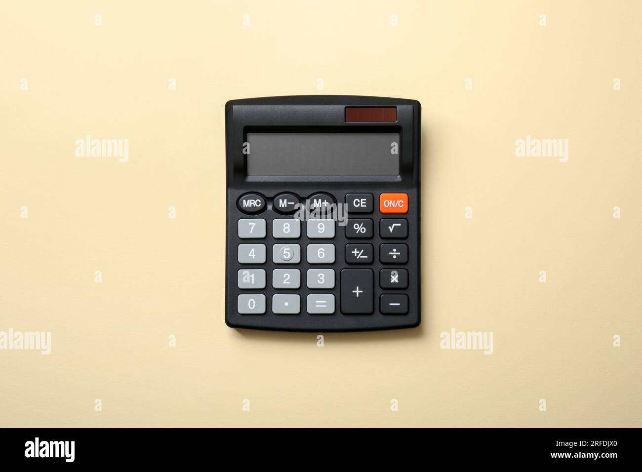 Calculator on beige background, top view. Office equipment Stock Photo ...