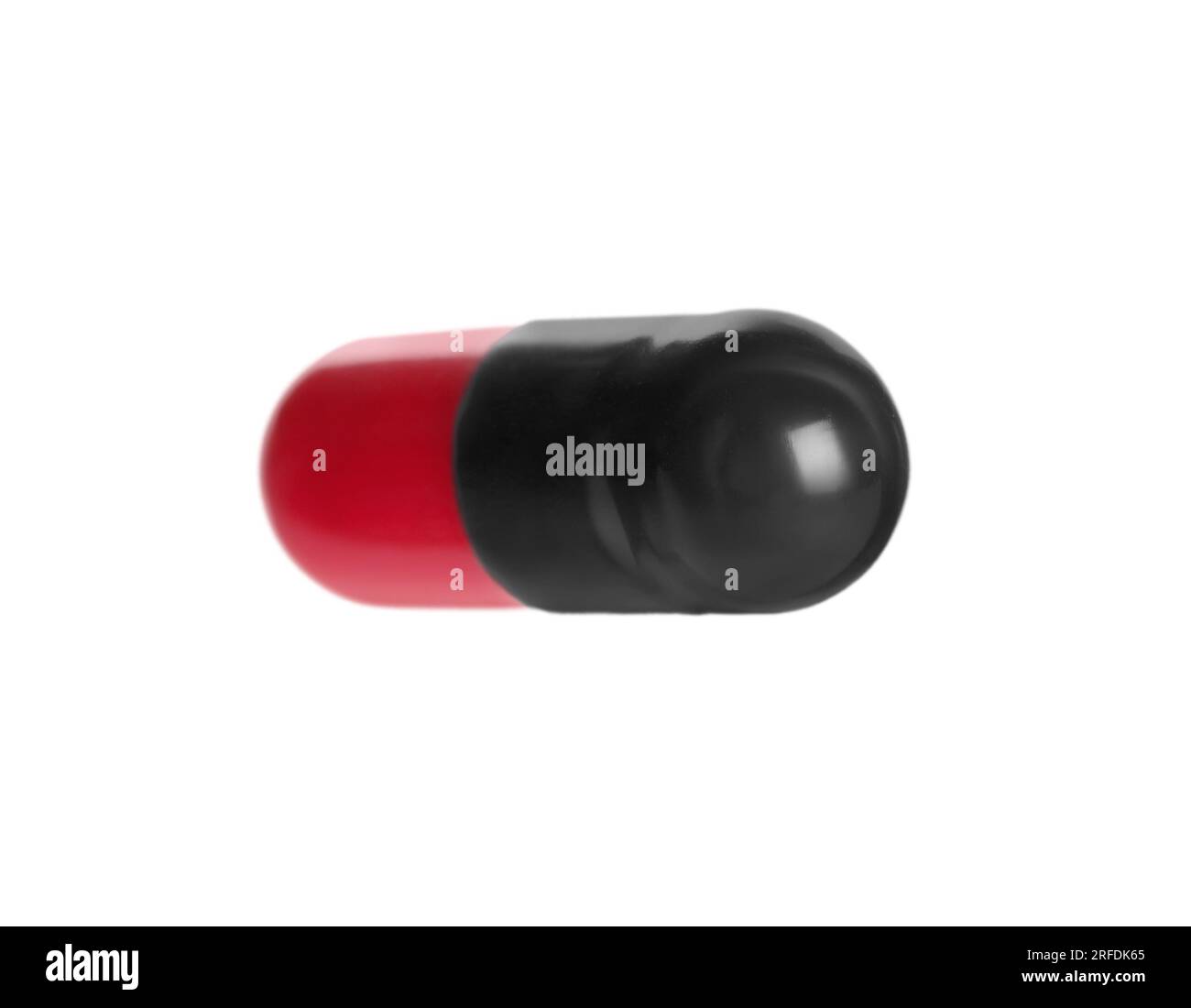 One pill isolated on white. Medicinal treatment Stock Photo - Alamy