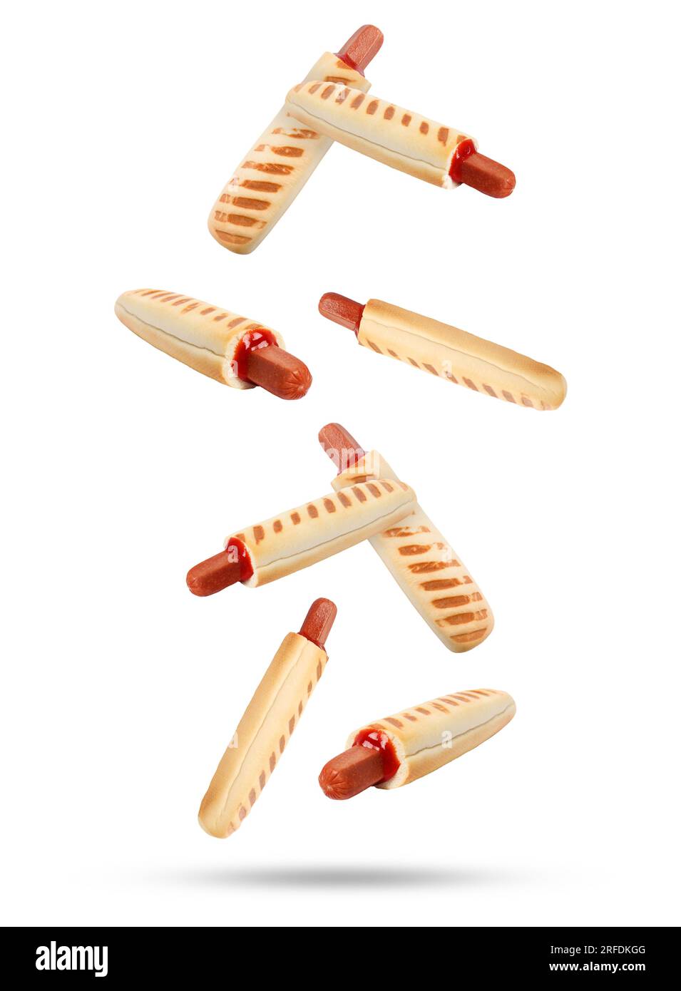 Yummy French hot dogs with grilled buns falling on white background ...