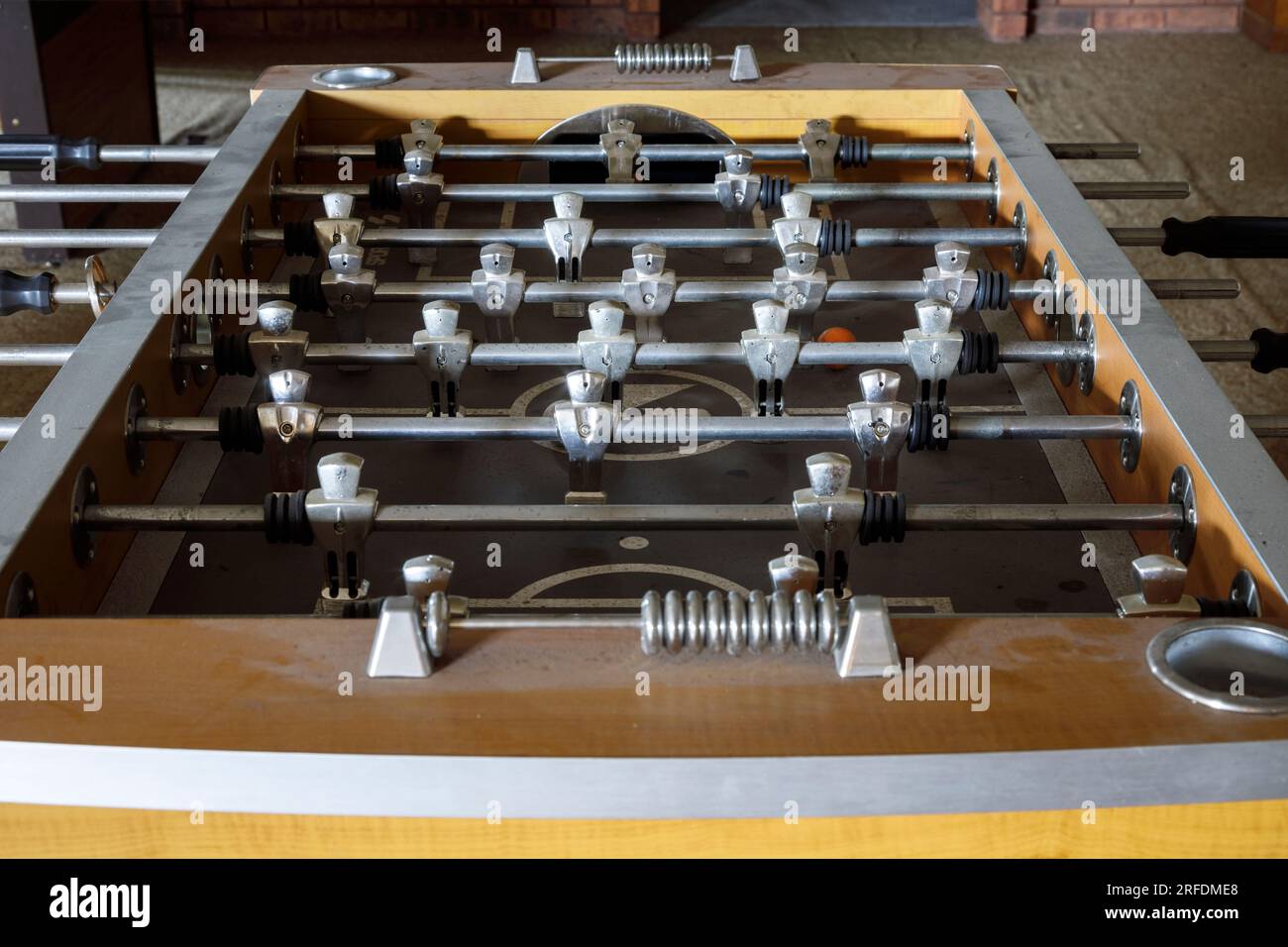 A fooseball table covered in dust Stock Photo - Alamy