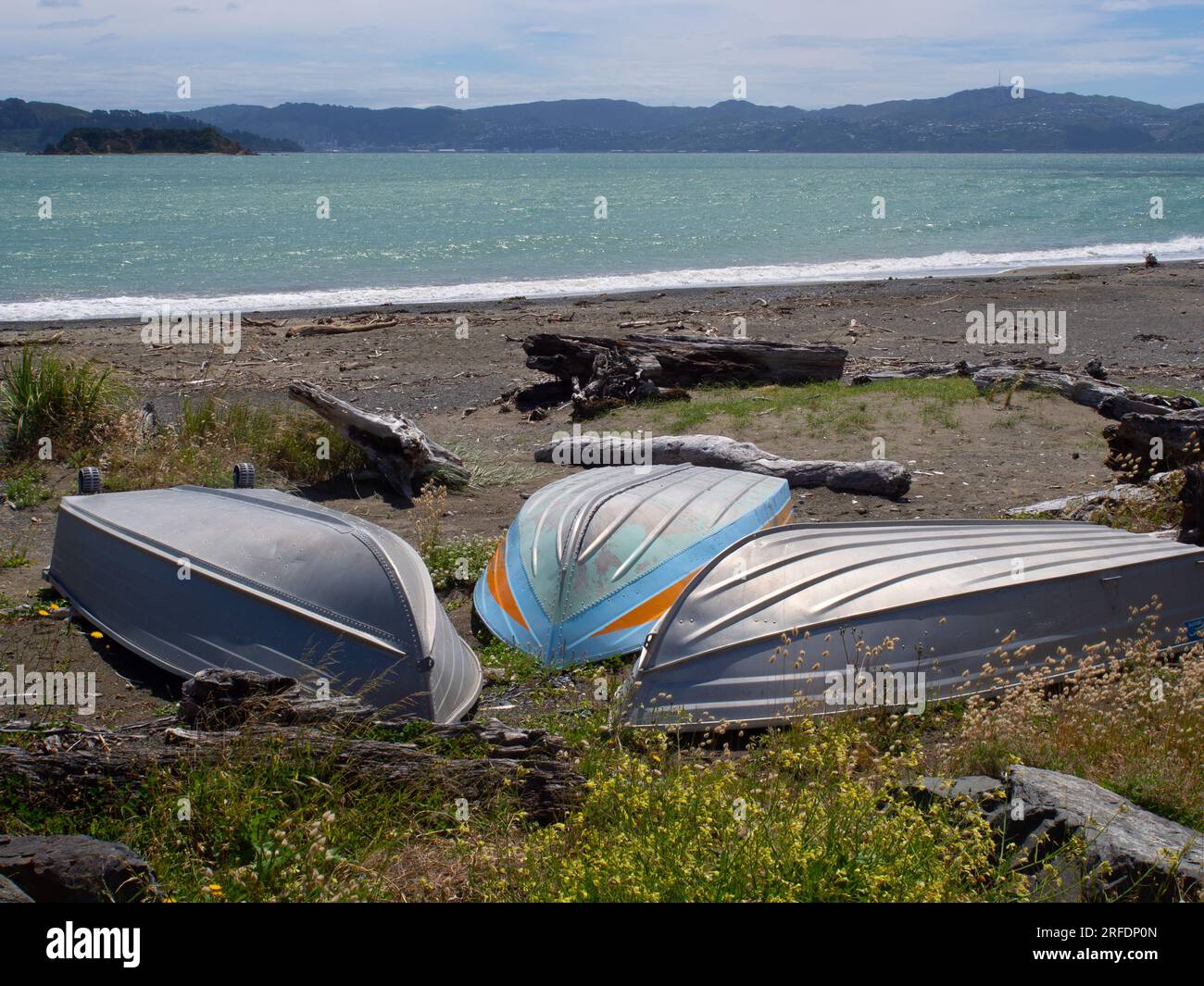 Row Boats Upside Down On Beach Stock Photo - Alamy
