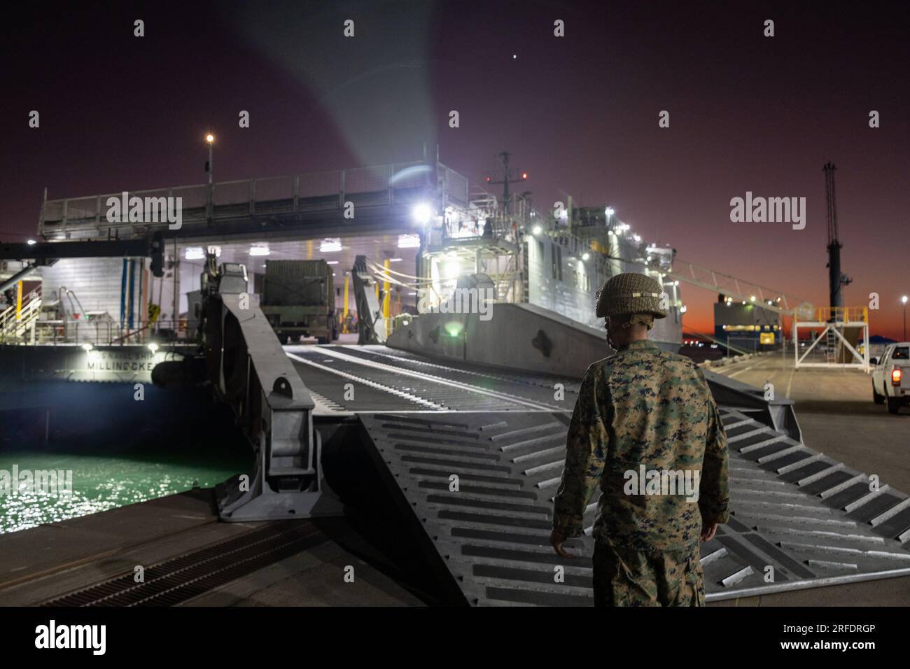 A loading truck drives onto the USNS Millinocket (T-EPF 3) in ...