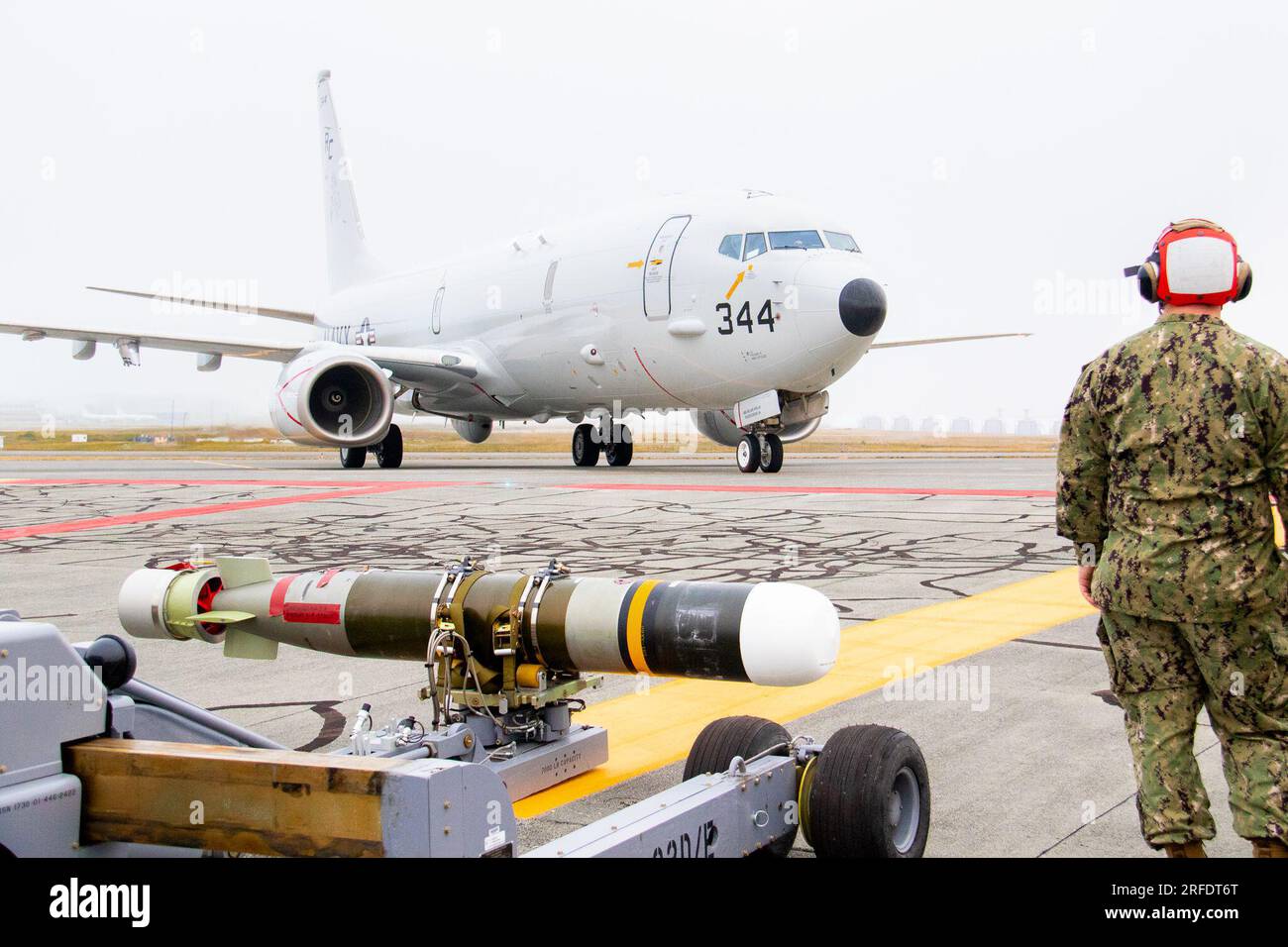 Sailors attached to Patrol Squadron (VP) 46, the 'Grey Knights,' loaded ...