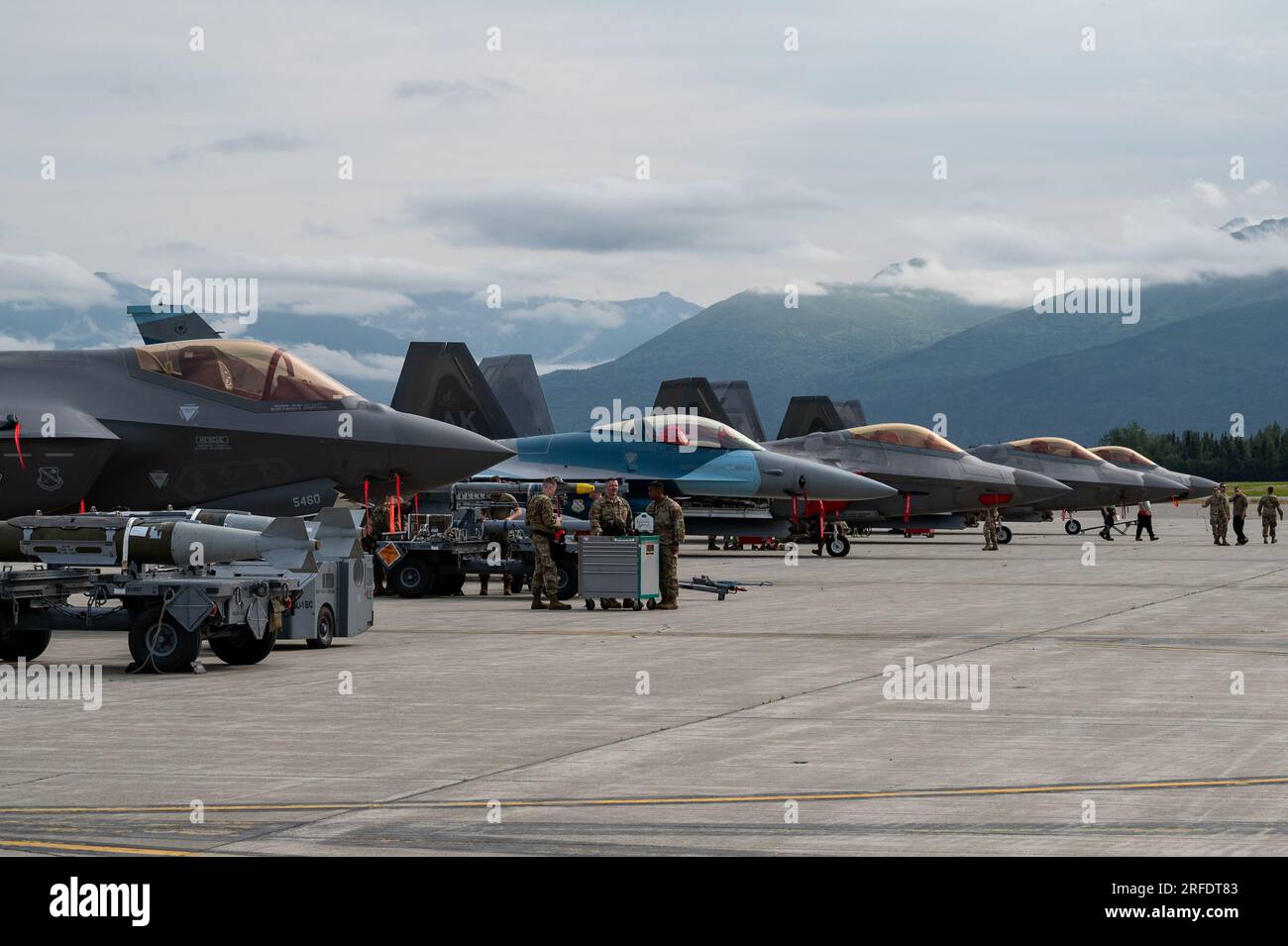 A U.S. Air Force F-35 Lightning II, F-16 Strike Eagle, and three F-22 ...