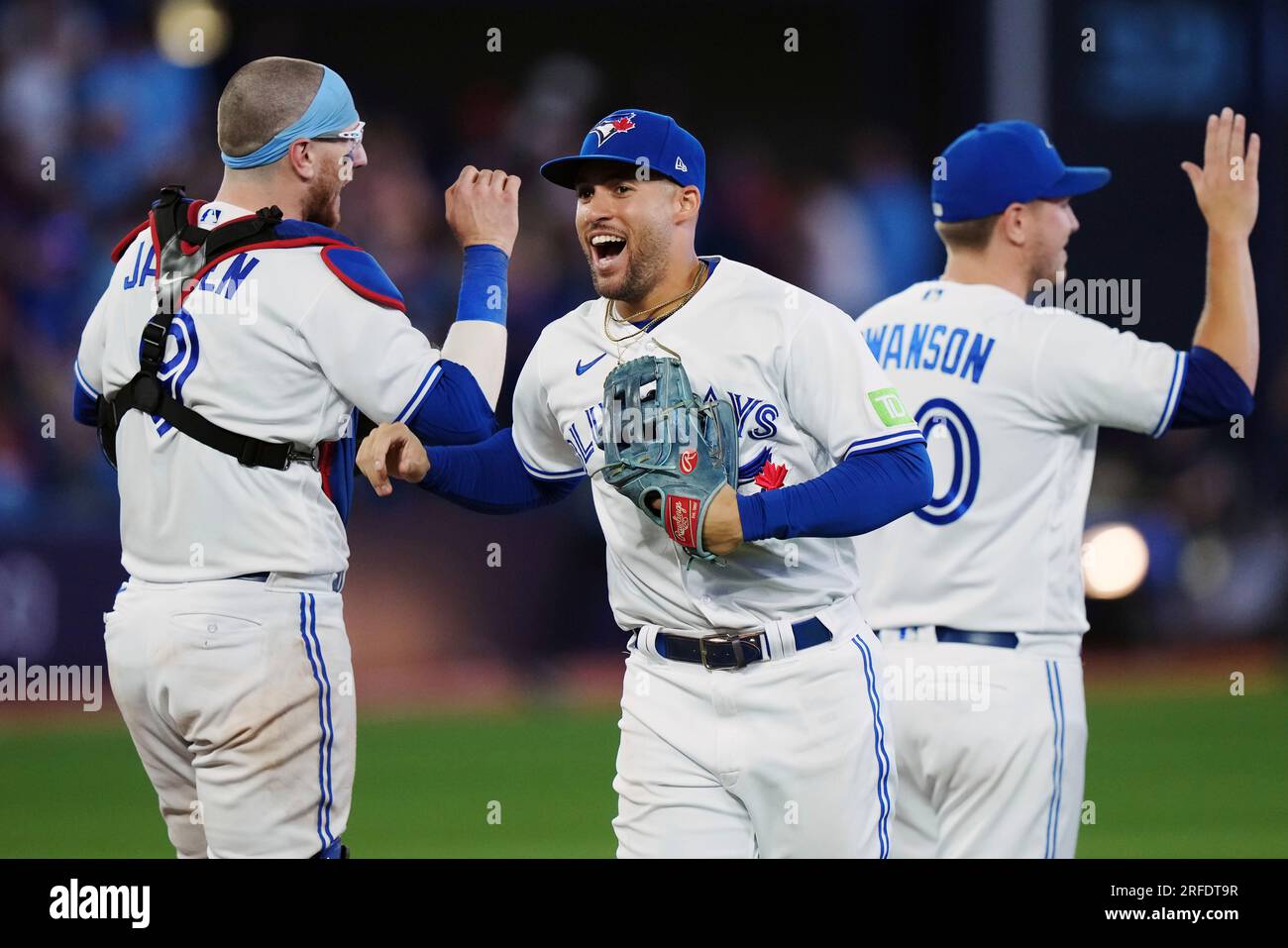 Toronto Blue Jays' George Springer, center, and Danny Jansen, left ...