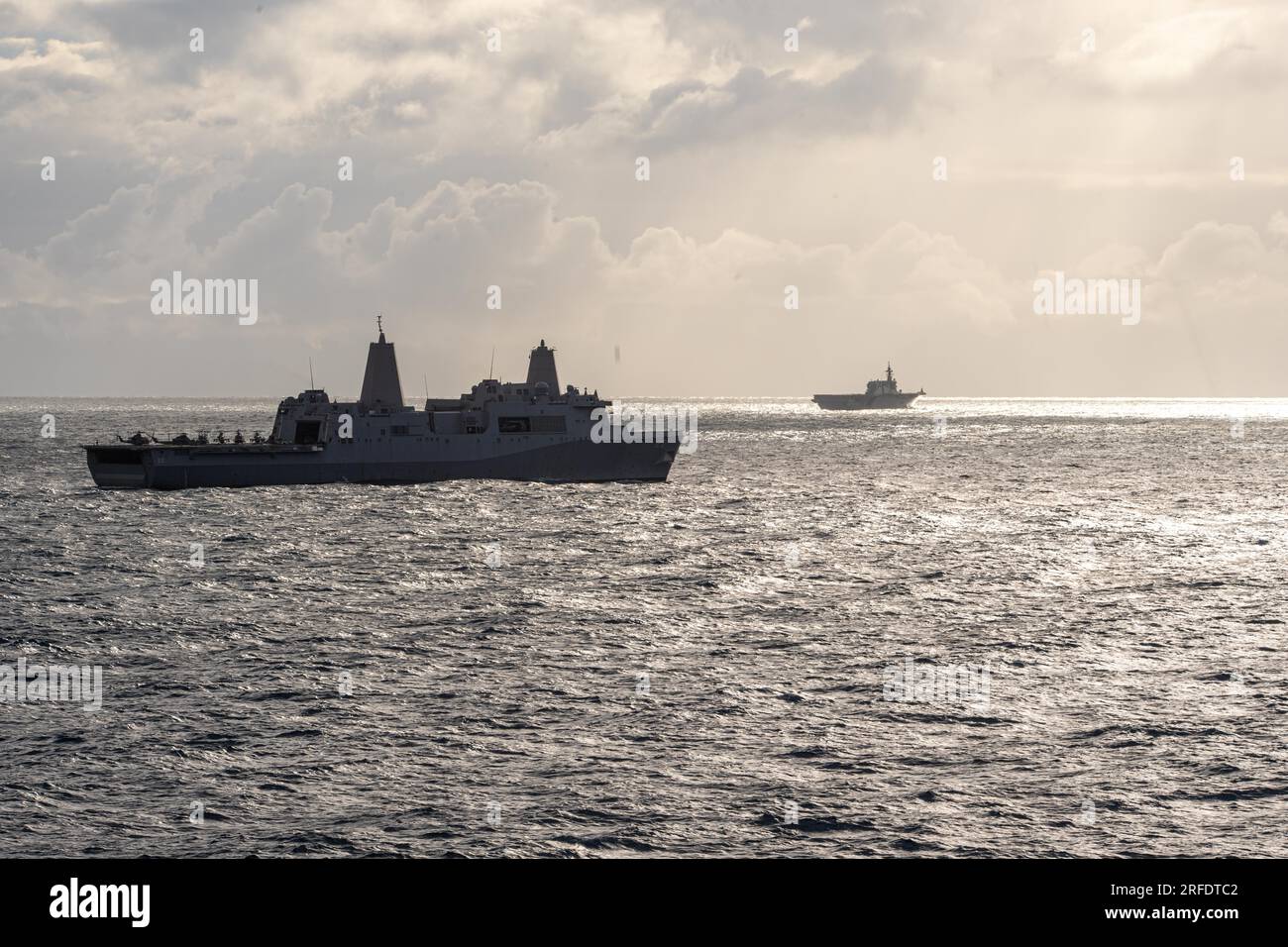 CORAL SEA (July 24, 2023) The USS Green Bay (LPD 20), center, and JS ...
