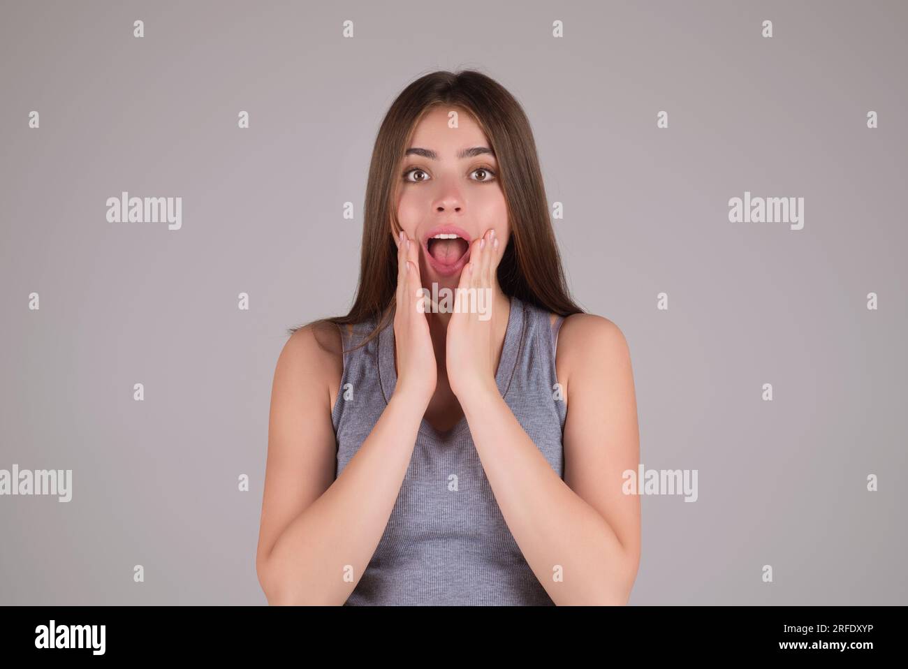 Close up photo of impressed woman isolated over studio background ...