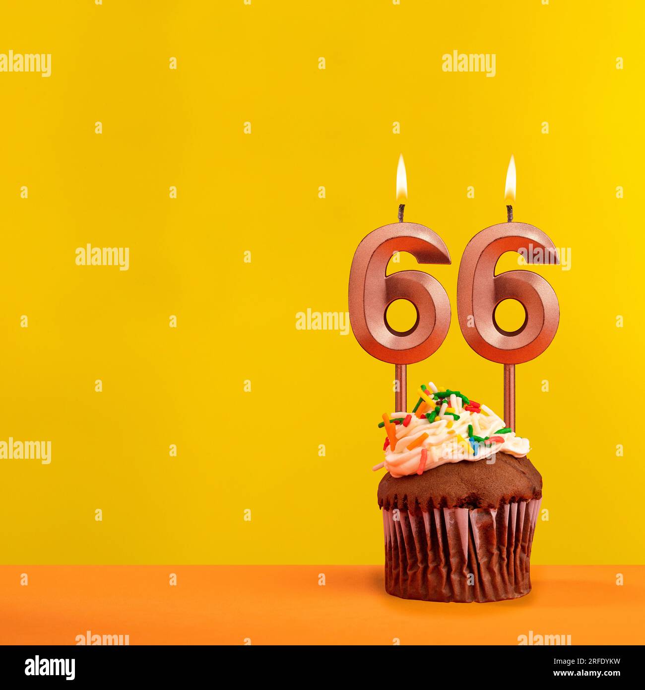 Number 66 birthday candle - Celebration on yellow background Stock ...