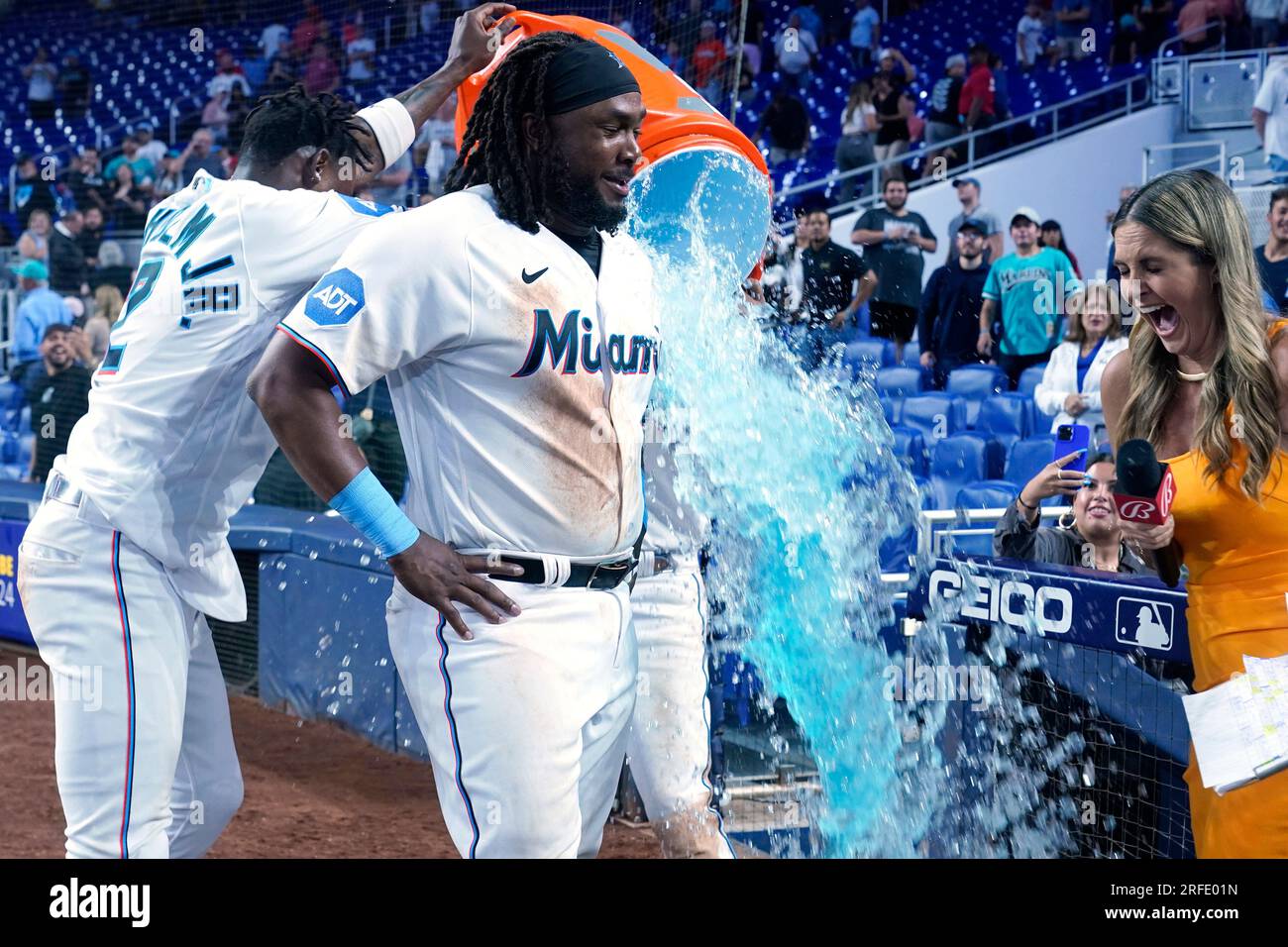 Miami Marlins' Jazz Chisholm Jr. (2) pours a bucket of Gatorade on Josh ...