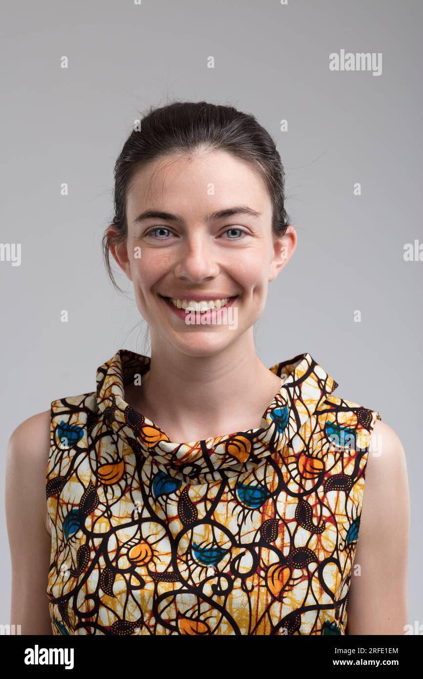 Woman in a centered frontal portrait, experiencing intense joy, smiling ...