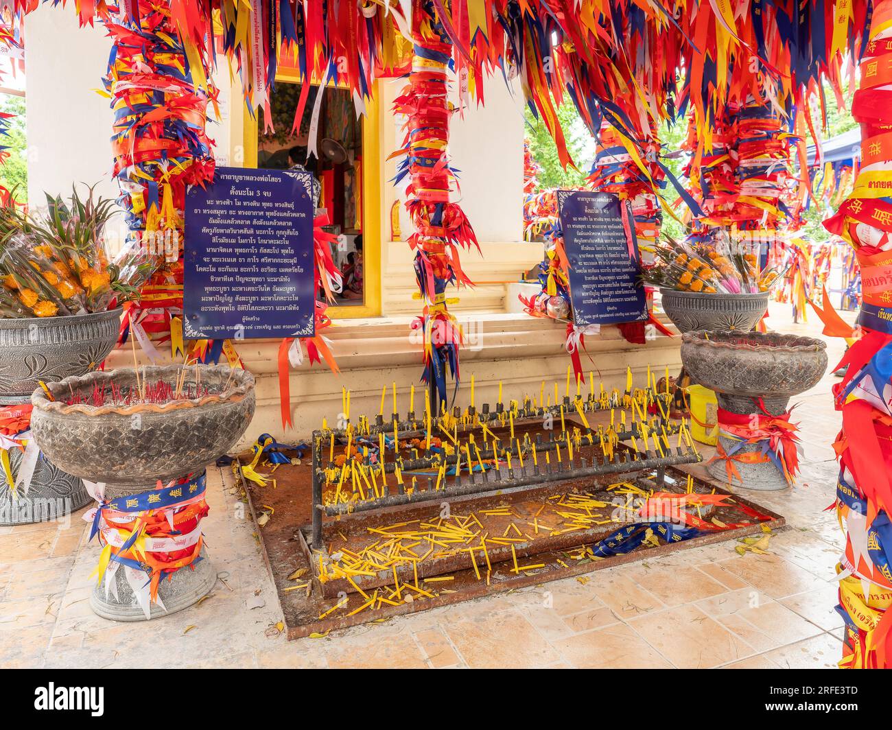 Candles and ribbons at the hilltop shrine at Wat Khao Tabaek in ...