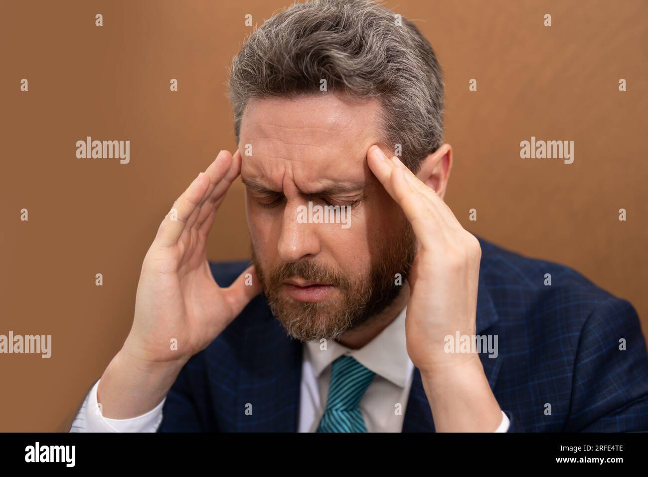 Headache and eye strain on laptop. Business man with stress and fatigue ...