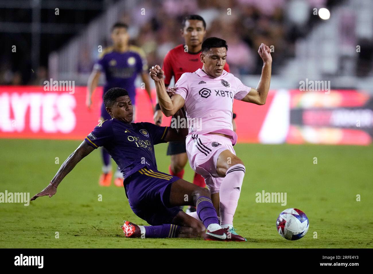 Inter Miami midfielder Diego Gomez, right, is tackled by Orlando City ...