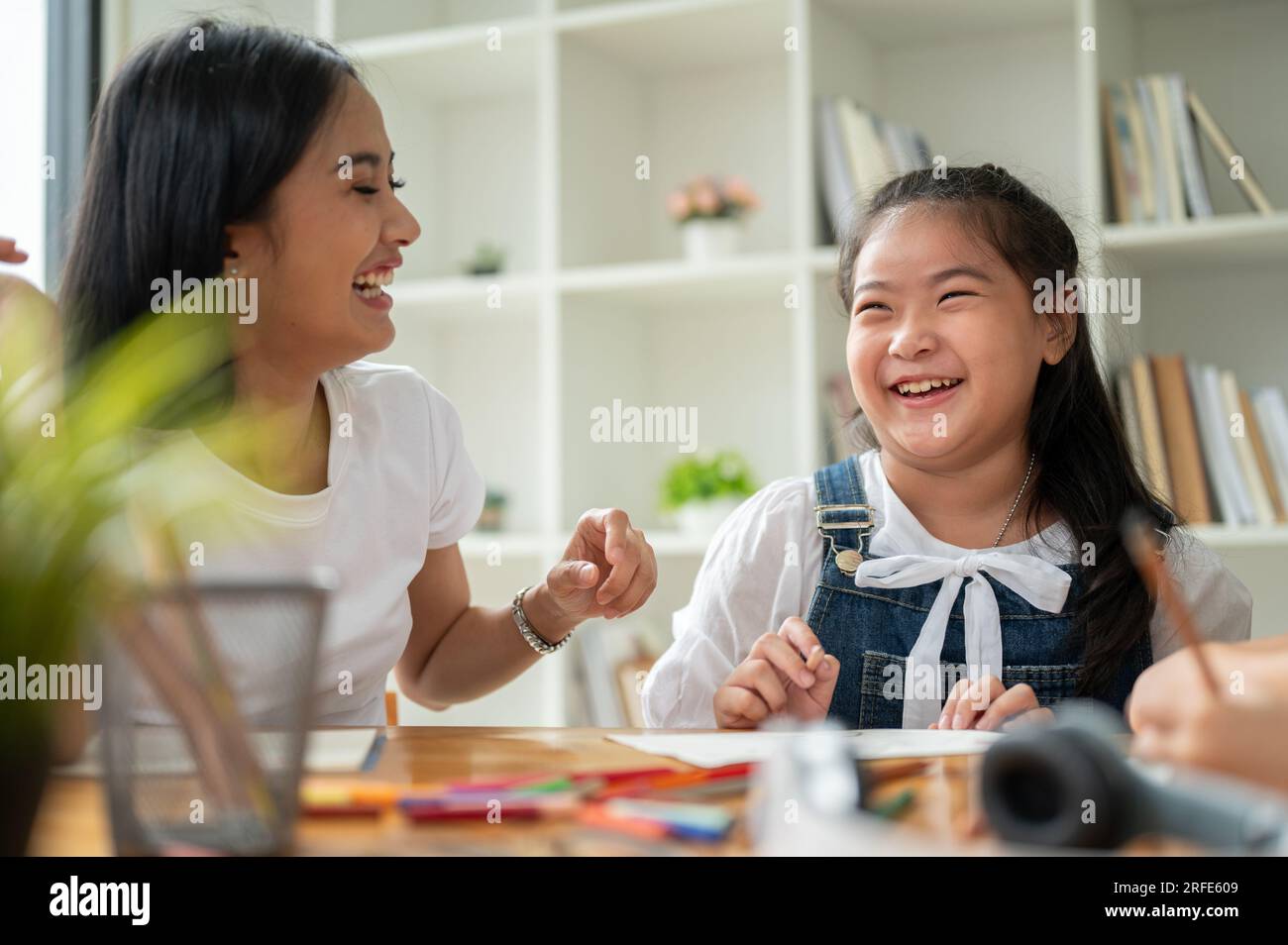 Children laughing teacher classroom hi-res stock photography and images ...