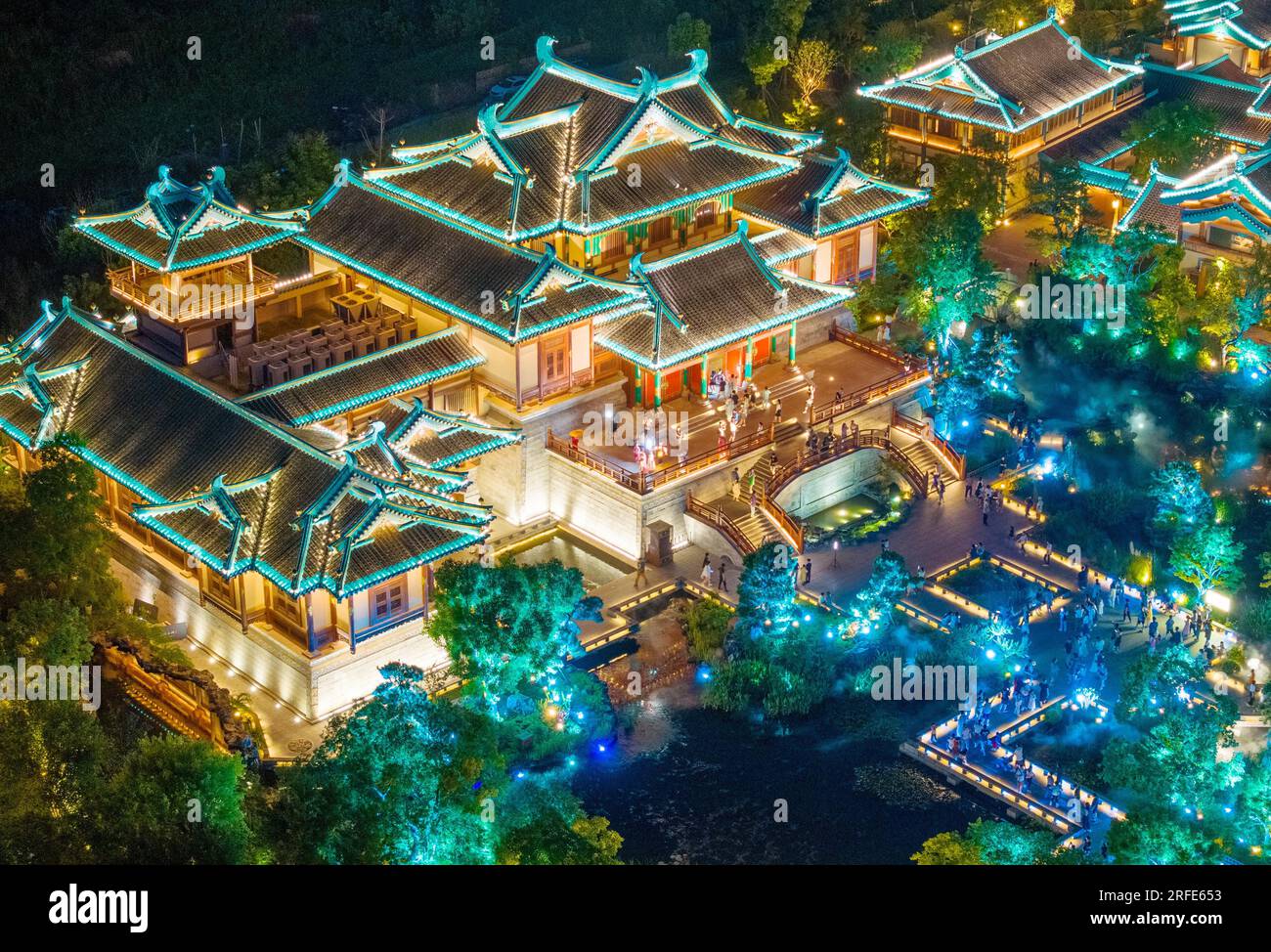 Aerial photo shows people visit Jinling Small City scenic area at night ...