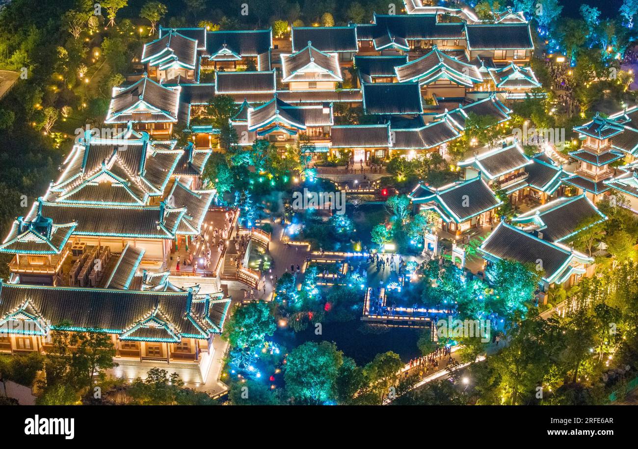 Aerial photo shows people visit Jinling Small City scenic area at night ...