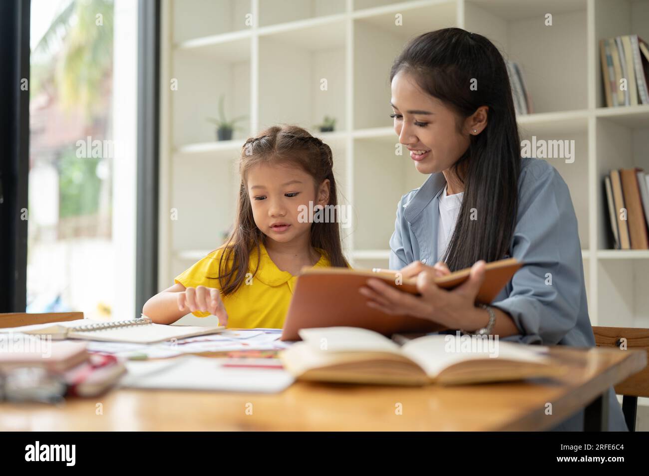Caring teacher hi-res stock photography and images - Alamy