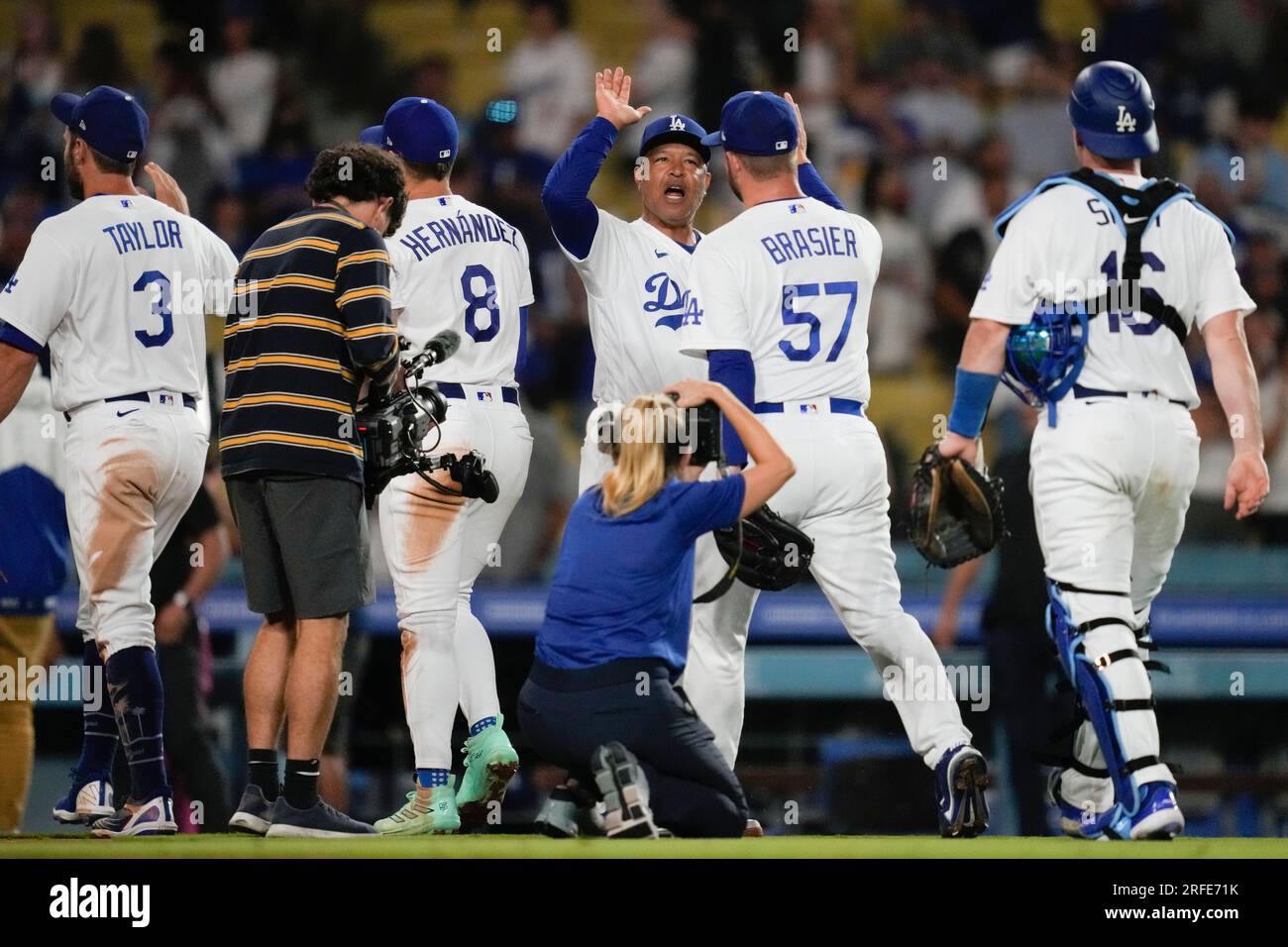 Los Angeles Dodgers Manager Dave Roberts, center, celebrates with ...