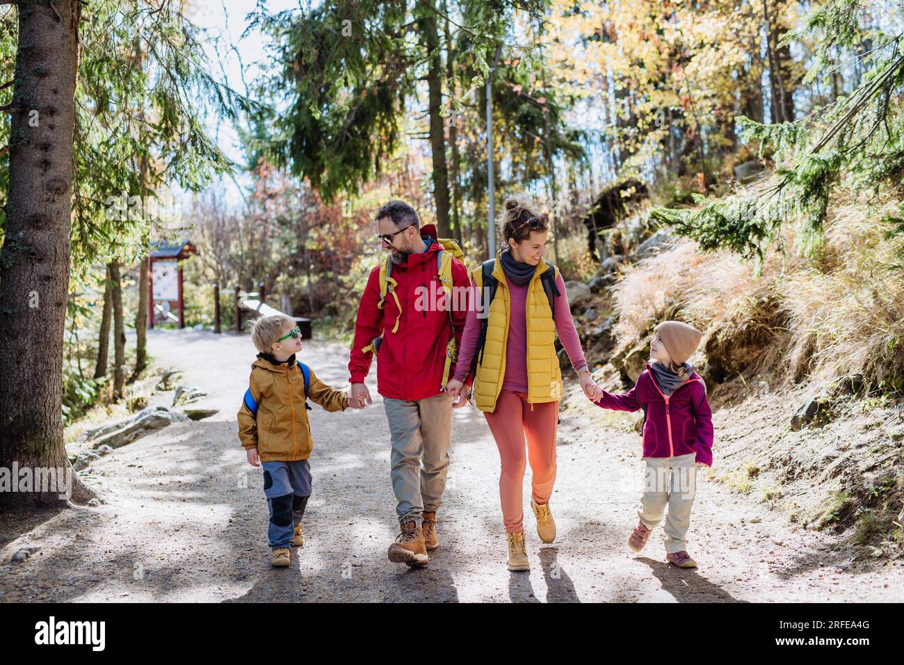 Happy family hiking together in autumn mountains Stock Photo - Alamy