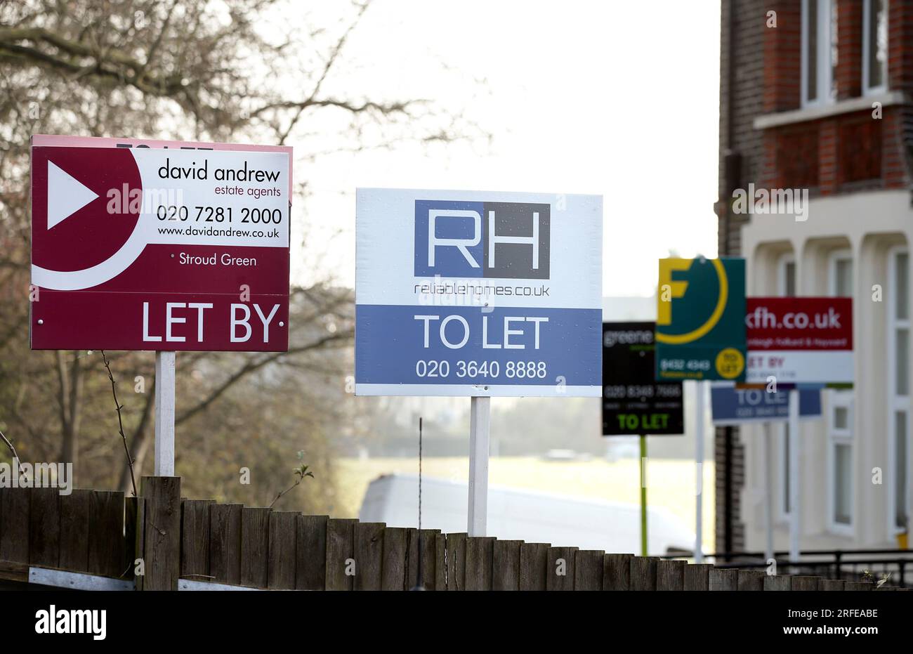 File photo dated 03/04/16 of estate agent signs placed outside homes ...