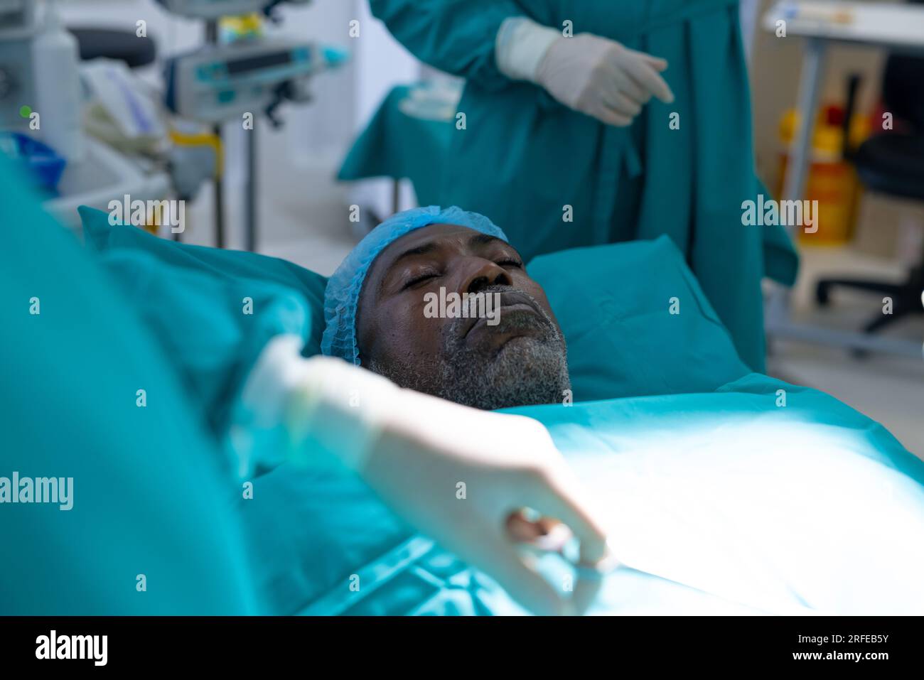 Close up of african american male patient in operating theatre at ...