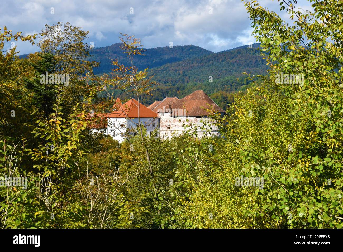 View of Turjak castle with forest covered hills behind in Dolenjska ...