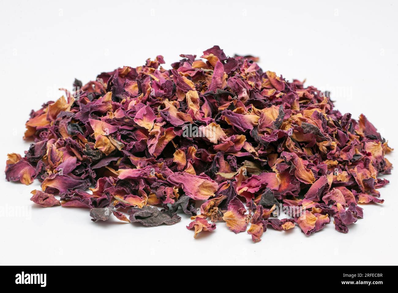 Pile of of Dried Rose Petals on a white surface Stock Photo - Alamy