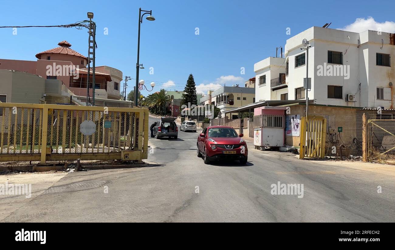 Cars pass through the entrance to the Israeli-annexed Alawite-Arab ...