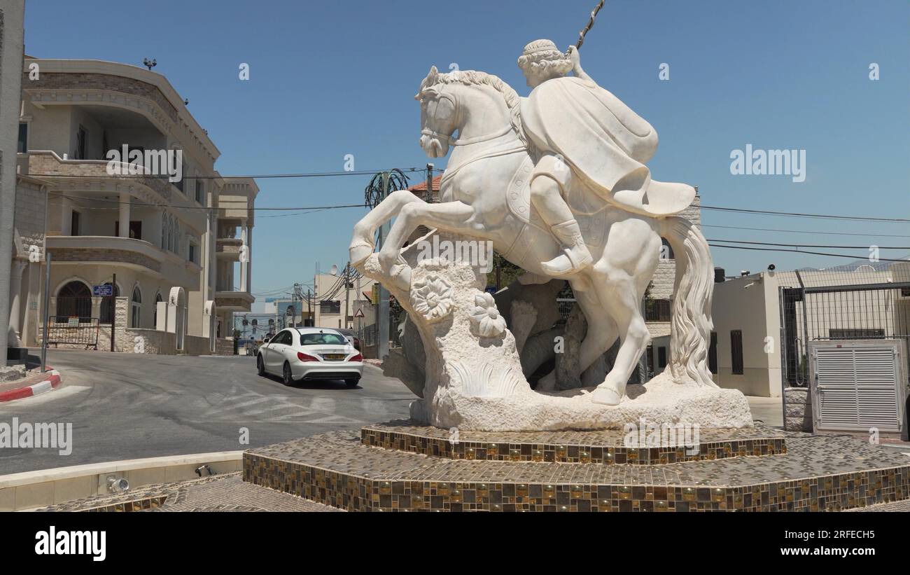 Cars drive through the Israeli-annexed Alawite-Arab village of Ghajar ...