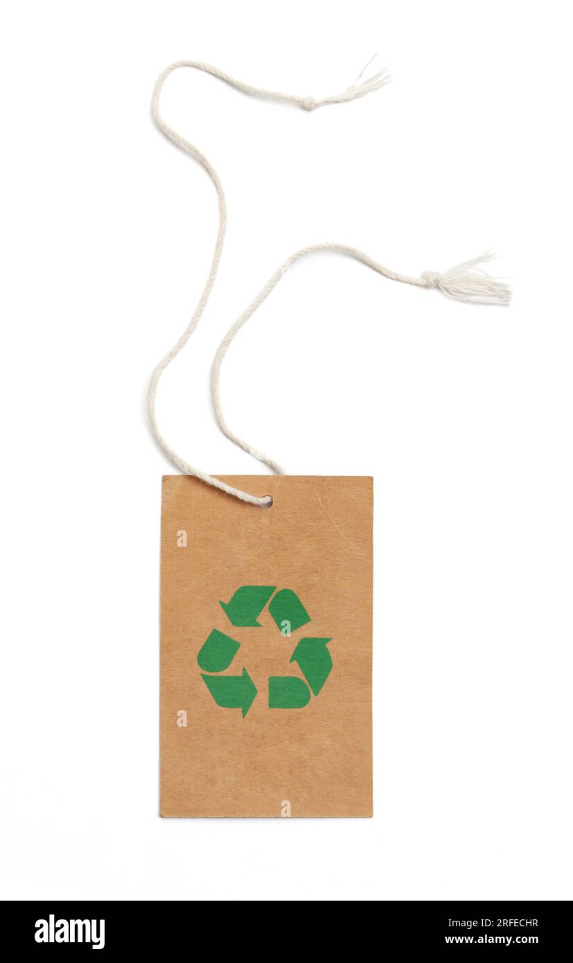 Kraft paper tag and green recycling sign. Beige recycled craft blank ...