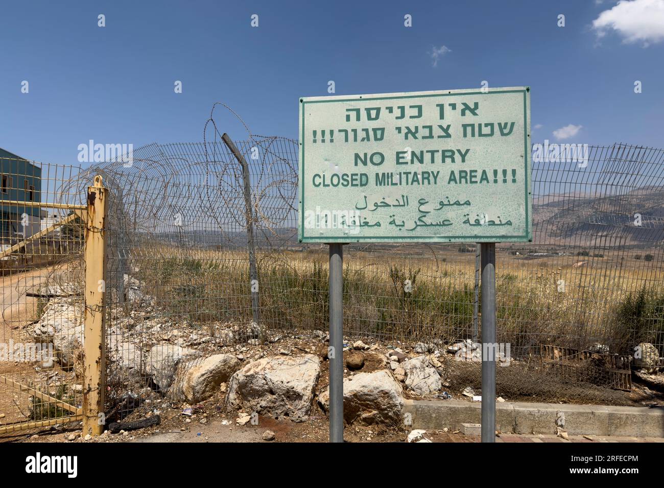 Barbed wire fence set up by Israel runs along the Israeli-annexed ...