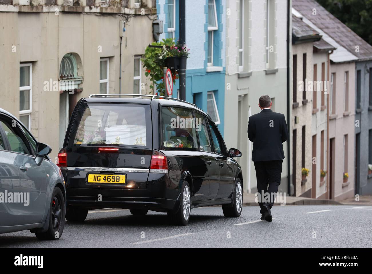 The hearse carrying the coffin of Dlava Mohamed leaves the family home ...